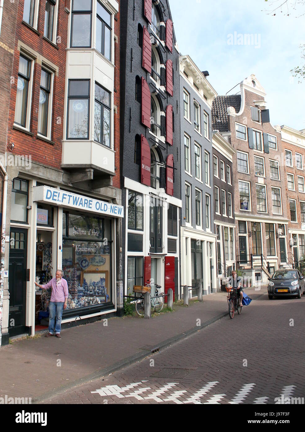 Owner of a traditional Dutch Delftware and China shop next to the store ...