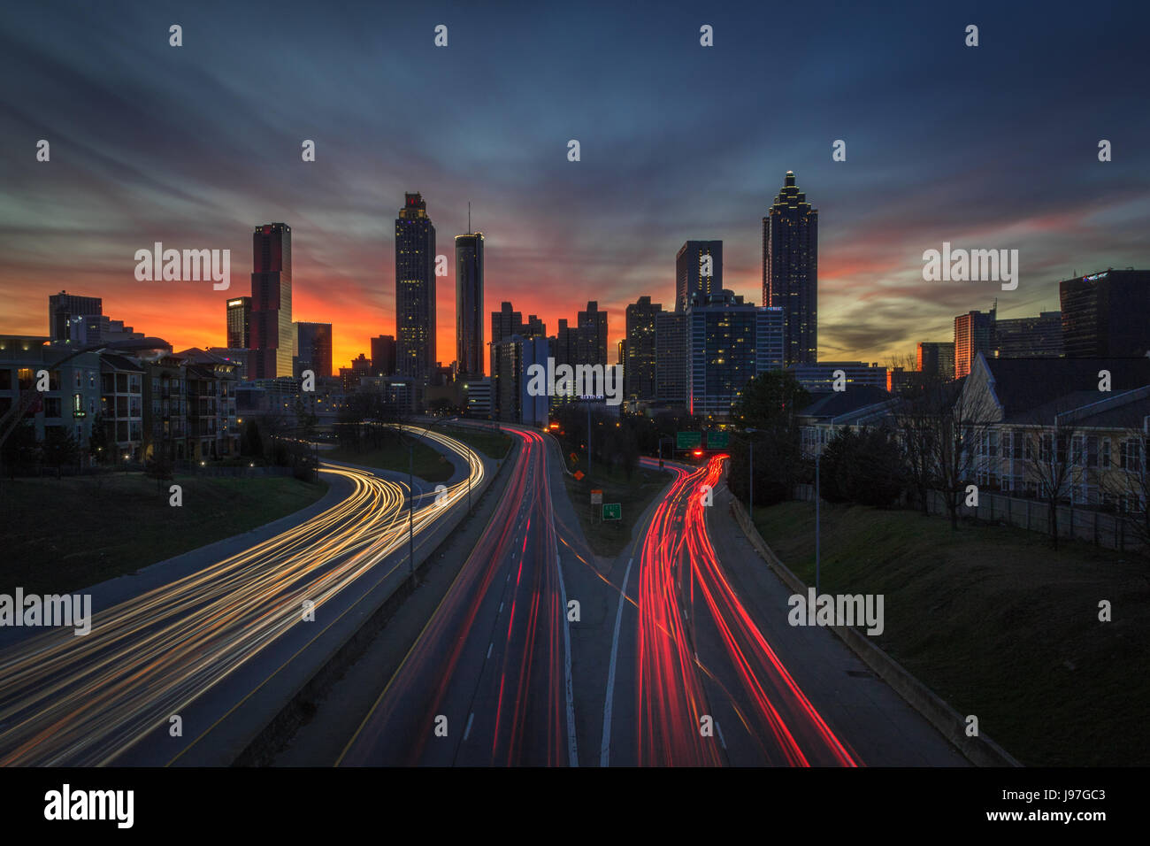 Long Exposure orange, pink, red, blue, purple sunset behind the Atlanta ...