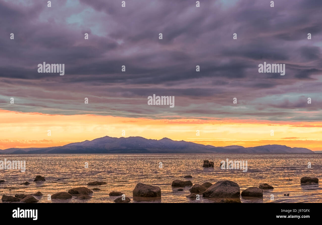 Looking accross the River Clyde over rocks towards Arran hills Stock ...