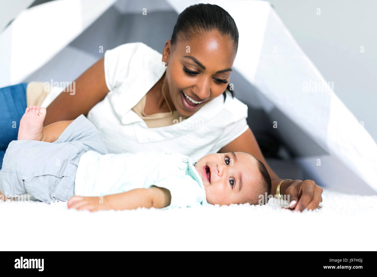 Family lying on floor open hi-res stock photography and images - Alamy