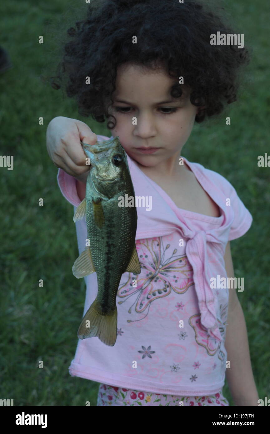 Girl with dead fish hi-res stock photography and images - Alamy