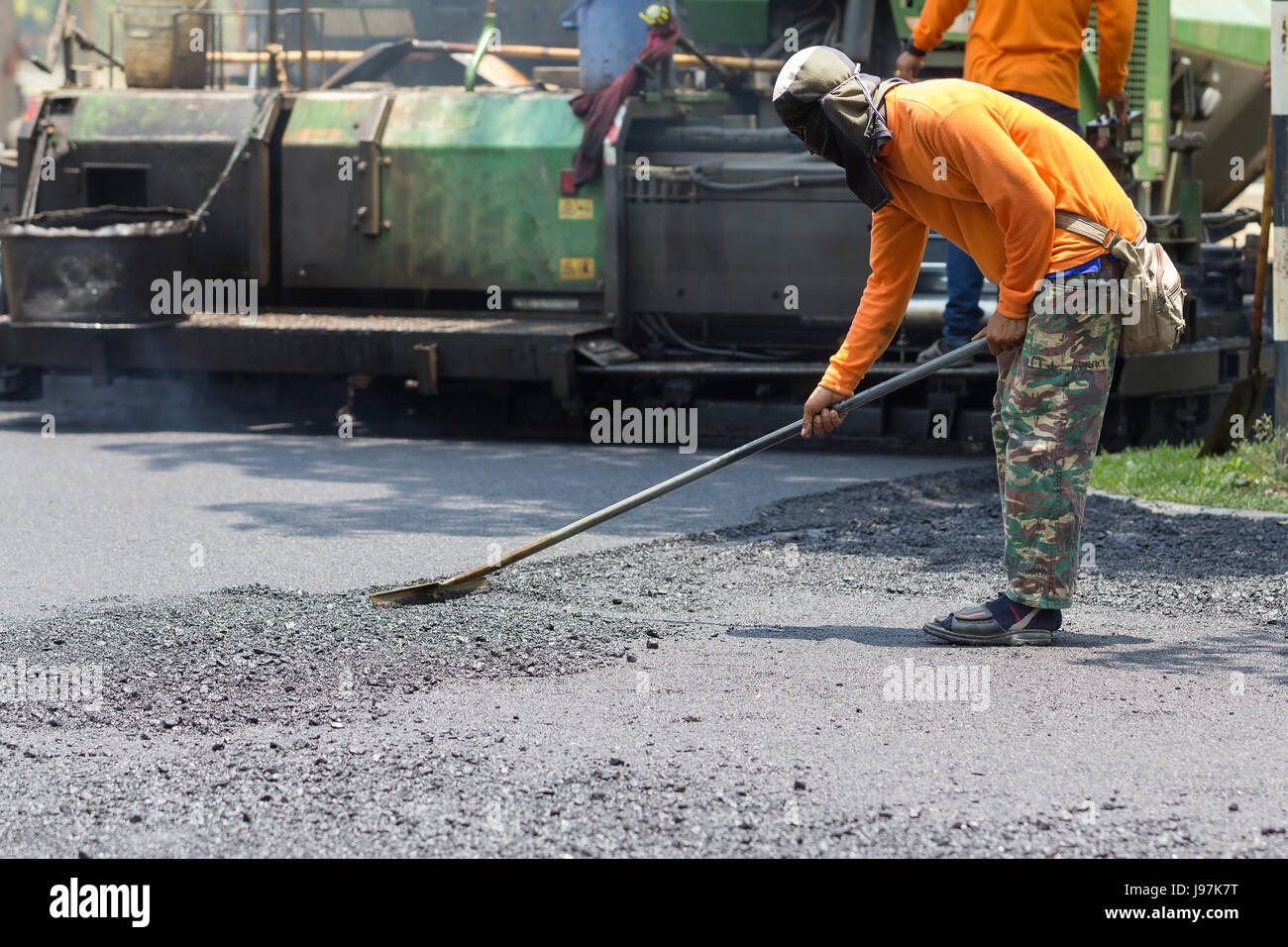Worker working in roadwork site Stock Photo - Alamy