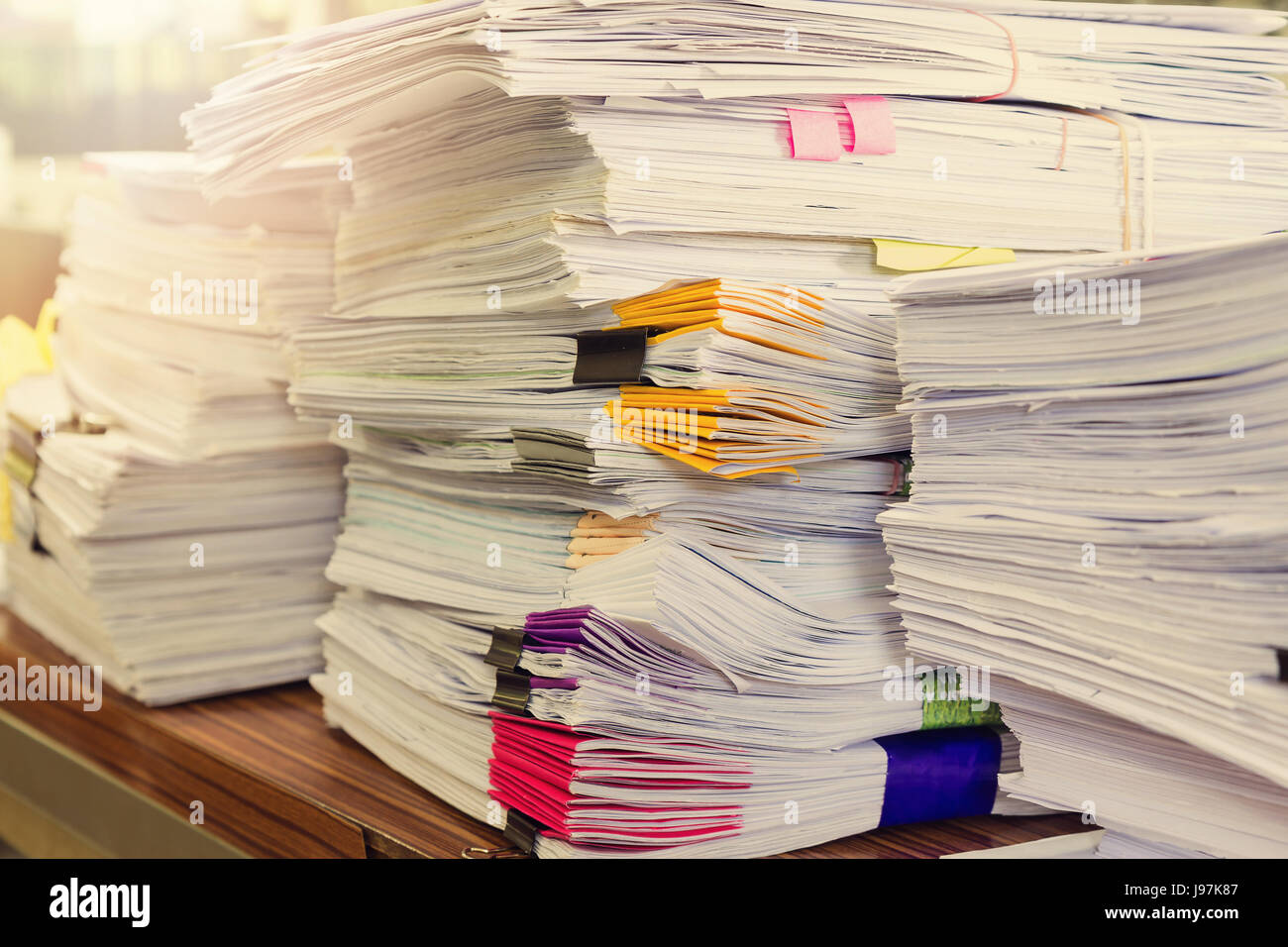 Pile of unfinished documents on office desk, Stack of business paper ...