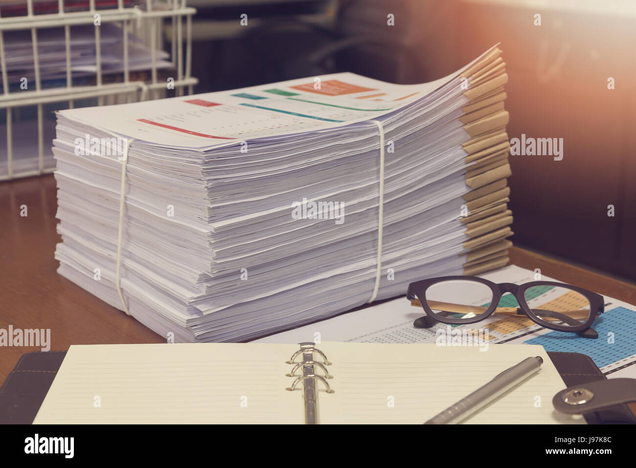 Pile of unfinished documents on office desk, Stack of business paper ...