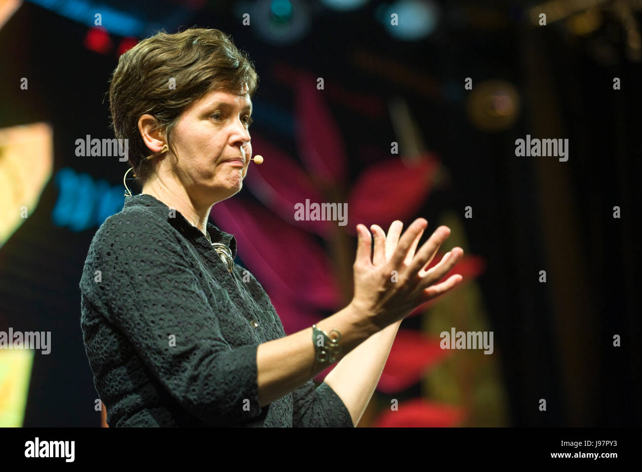Economist Kate Raworth author of Doughnut Economics speaking on stage ...