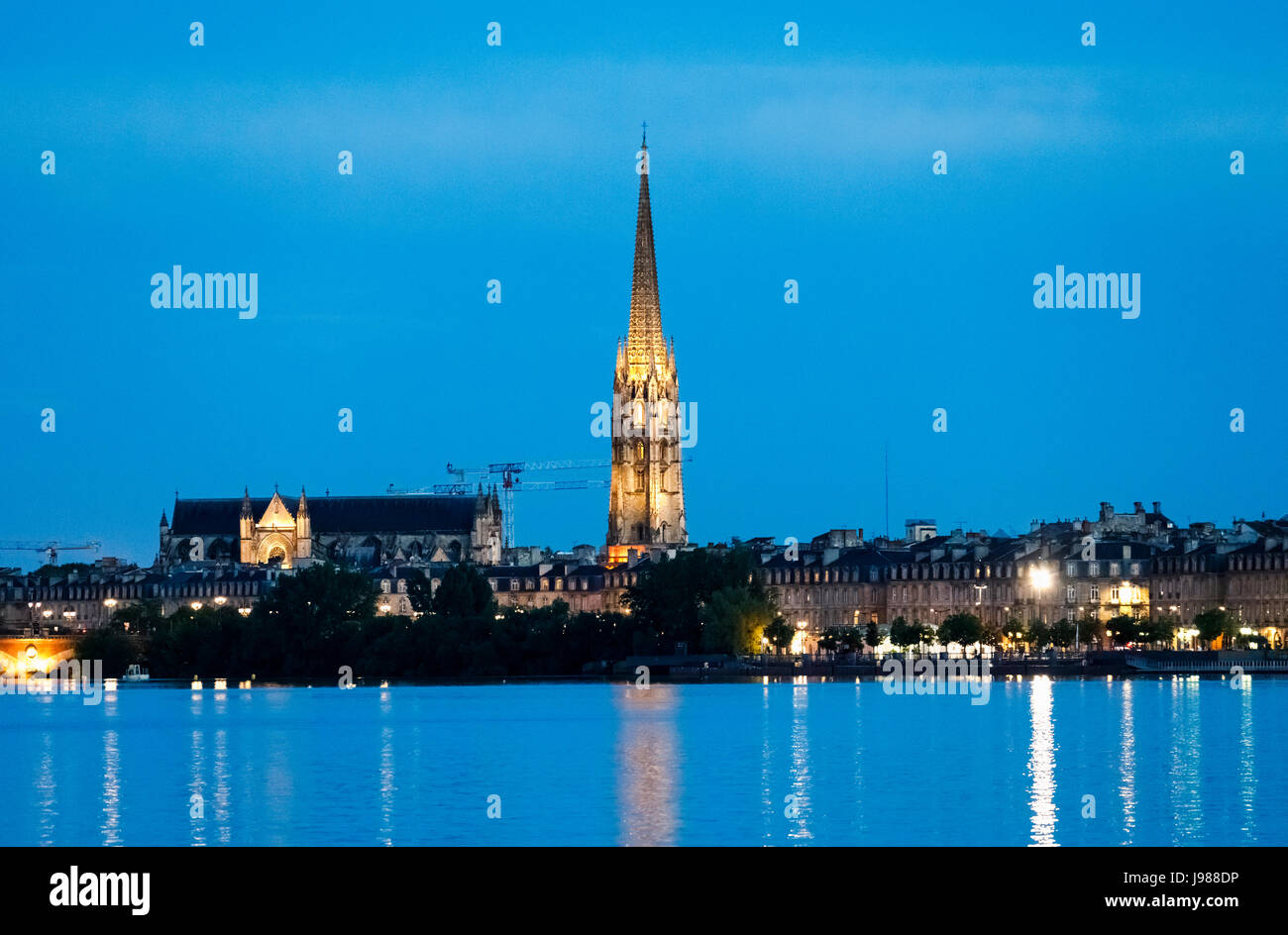 Panoramic evening view, Bordeaux waterfront and spire of St Michael's ...