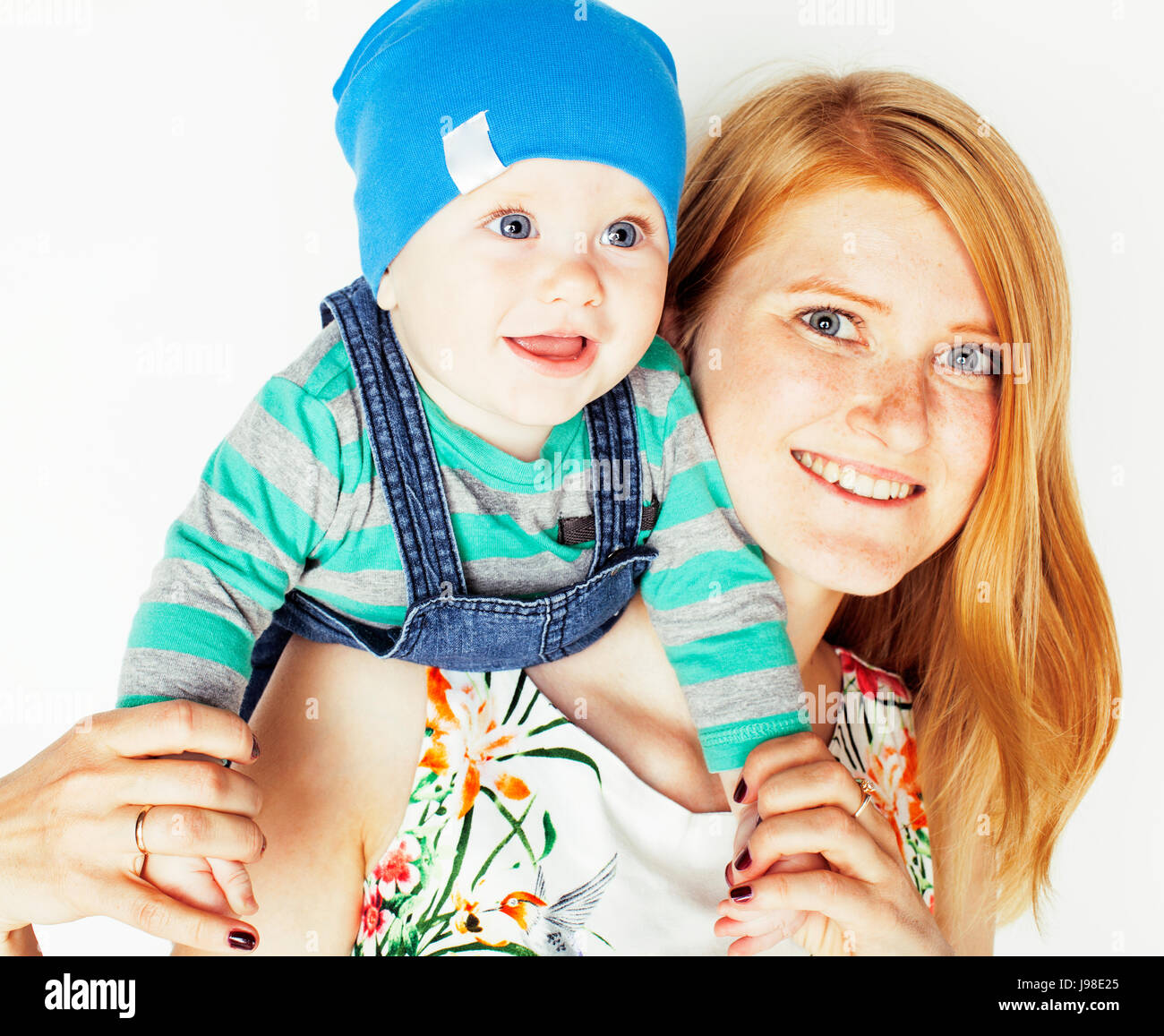 young beauty mother with cute baby, red head happy modern family Stock ...