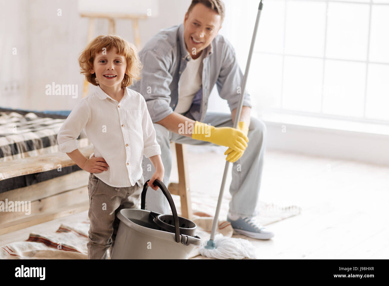Attractive kid putting his right hand on the belt Stock Photo - Alamy