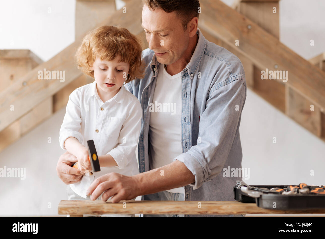 Very attentive father and son spending time with pleasure Stock Photo ...