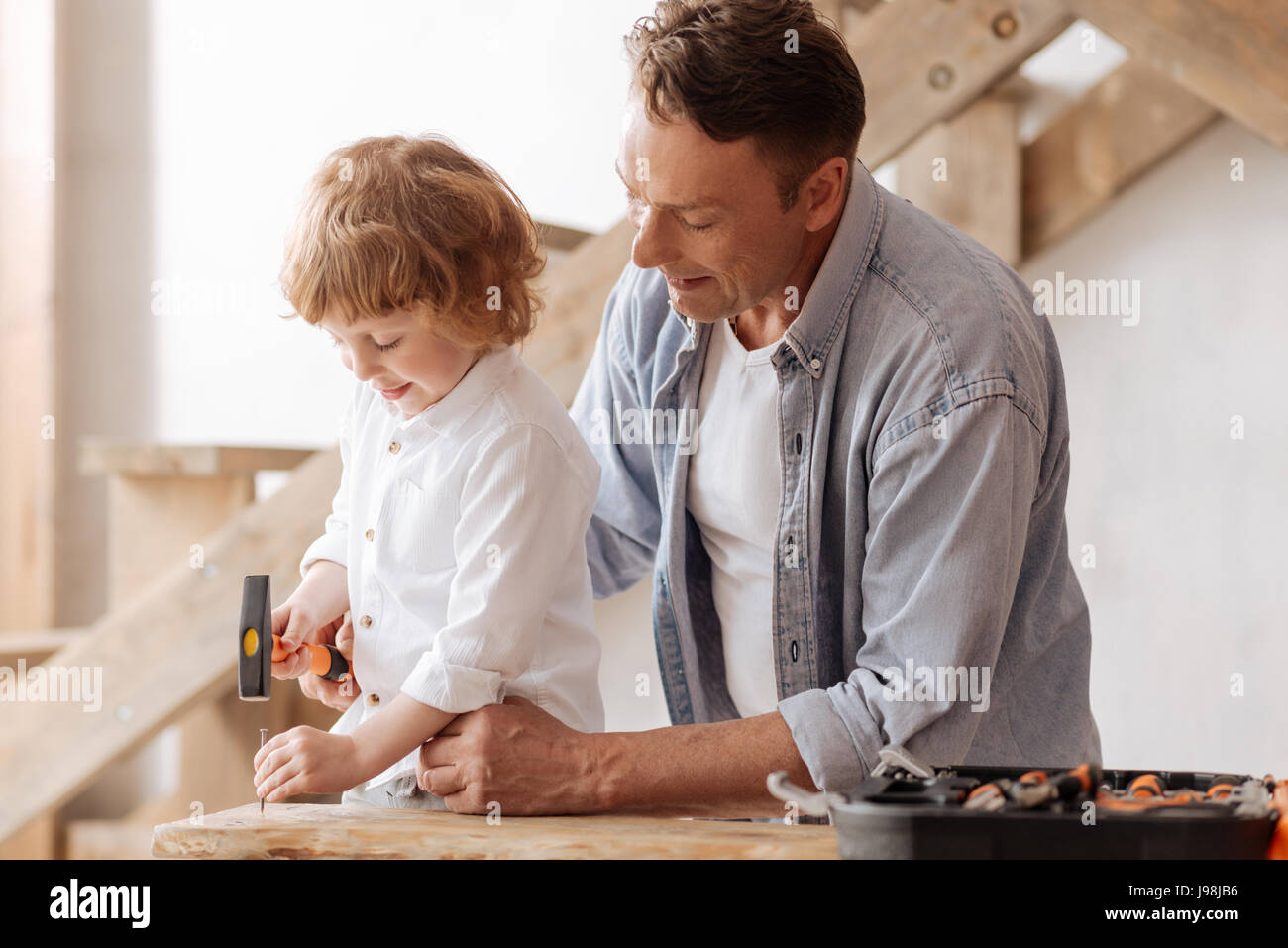 Both male relatives standing in semi position Stock Photo - Alamy