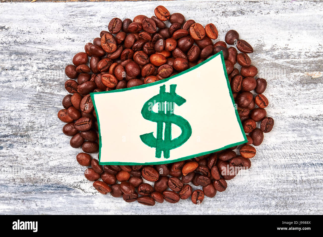 Coffee beans and painted money Stock Photo - Alamy