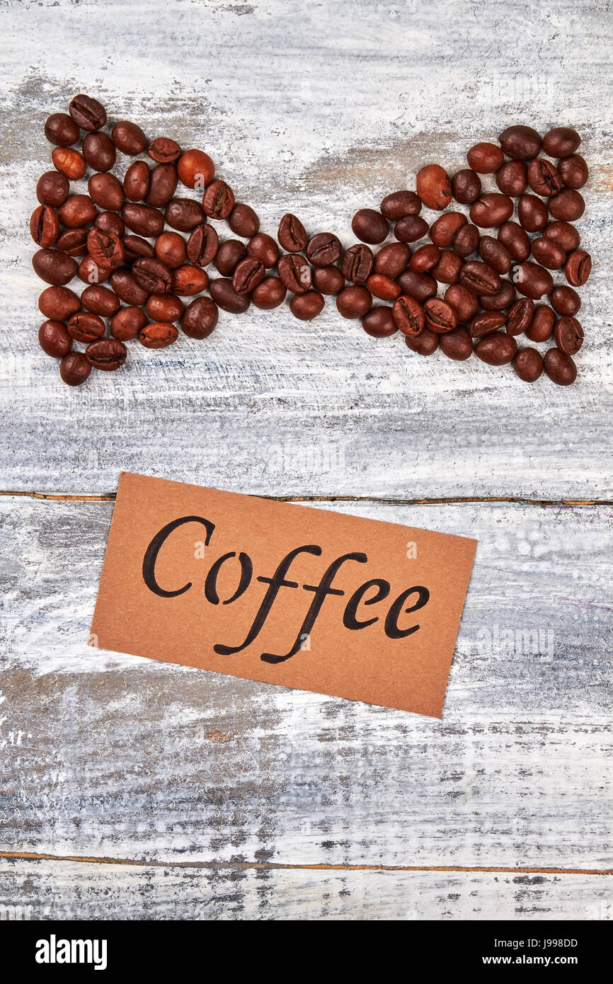 Bow from coffee beans, message Stock Photo - Alamy