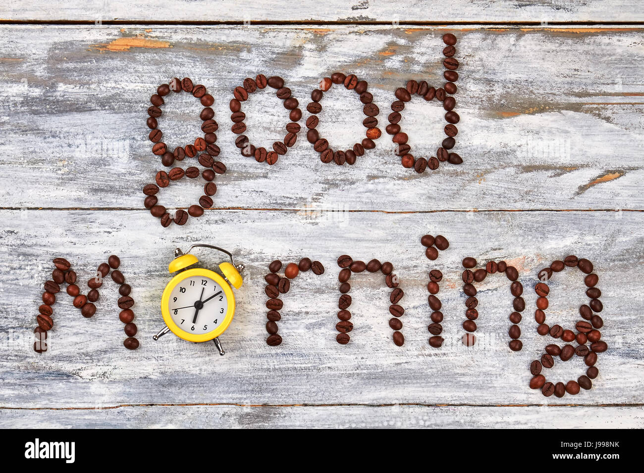 Good morning and alarm cloock Stock Photo - Alamy