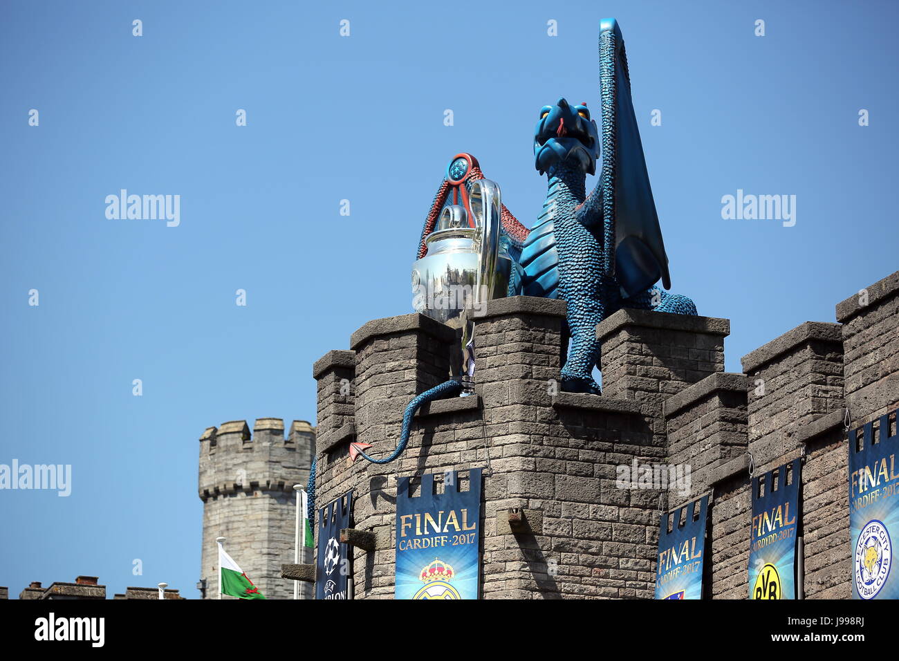 A blue dragon, the trophy and a series of UEFA banners draped outside ...