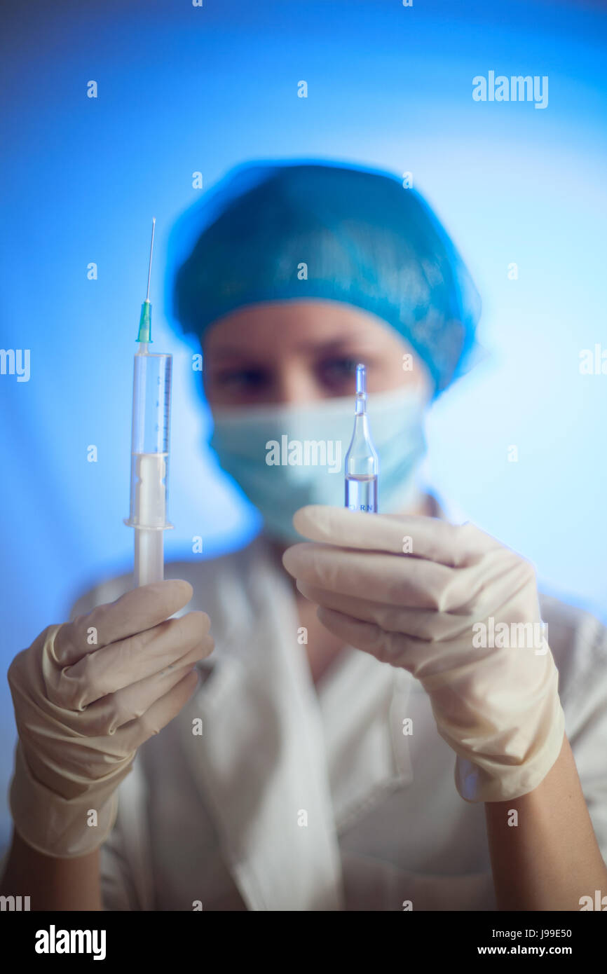 Syringe, medical injection in hand, palm or fingers. Medicine plastic ...