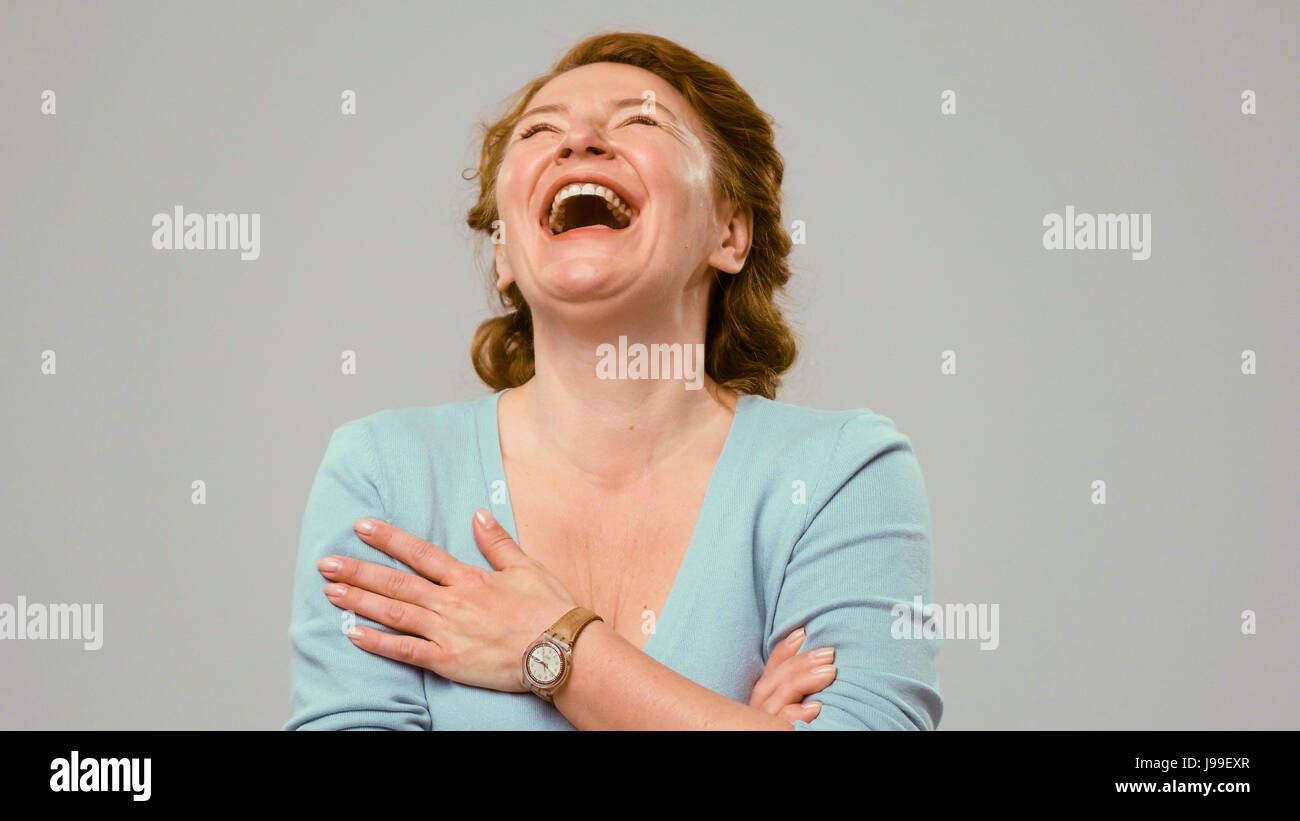 Mid aged actress laughing Stock Photo - Alamy