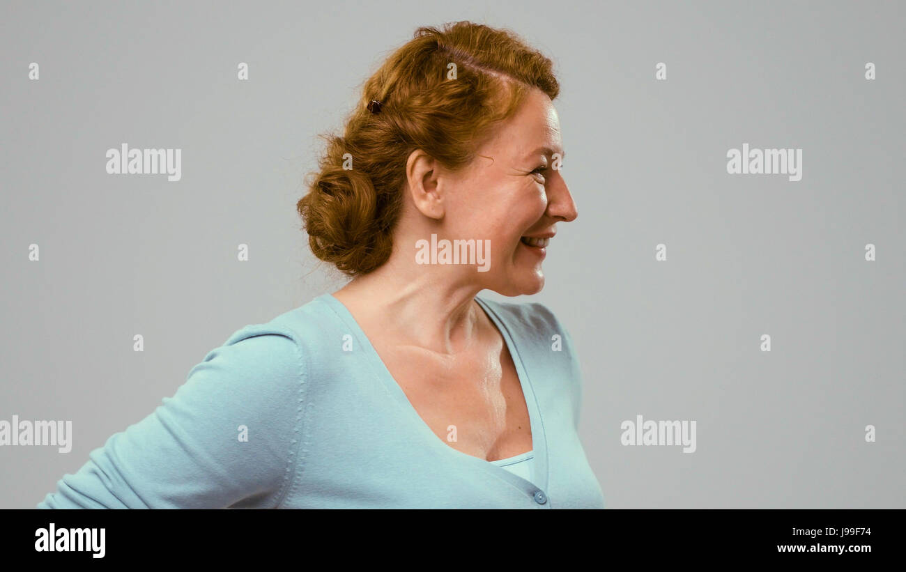 Mid aged actress in studio side view Stock Photo - Alamy
