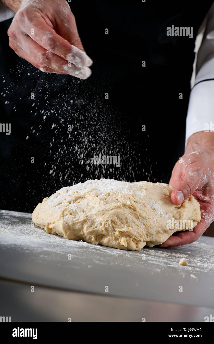Chef kneading dough, Making dough by male hands at bakery Stock Photo ...
