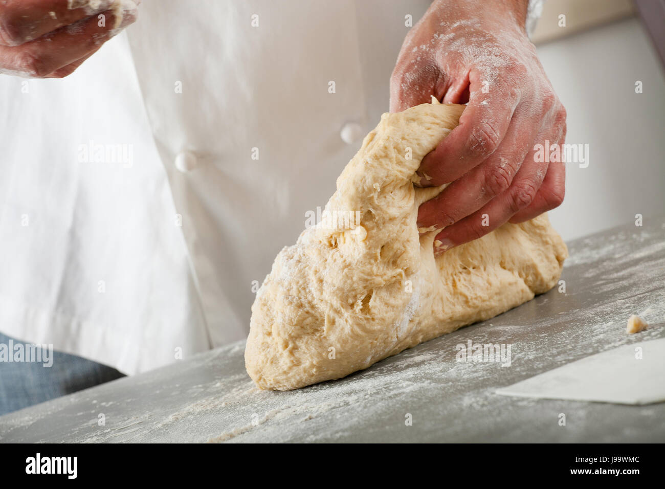 Chef kneading dough, Making dough by male hands at bakery Stock Photo ...