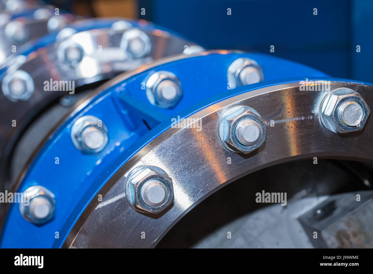The flanges of valves with bolts and nuts Stock Photo - Alamy