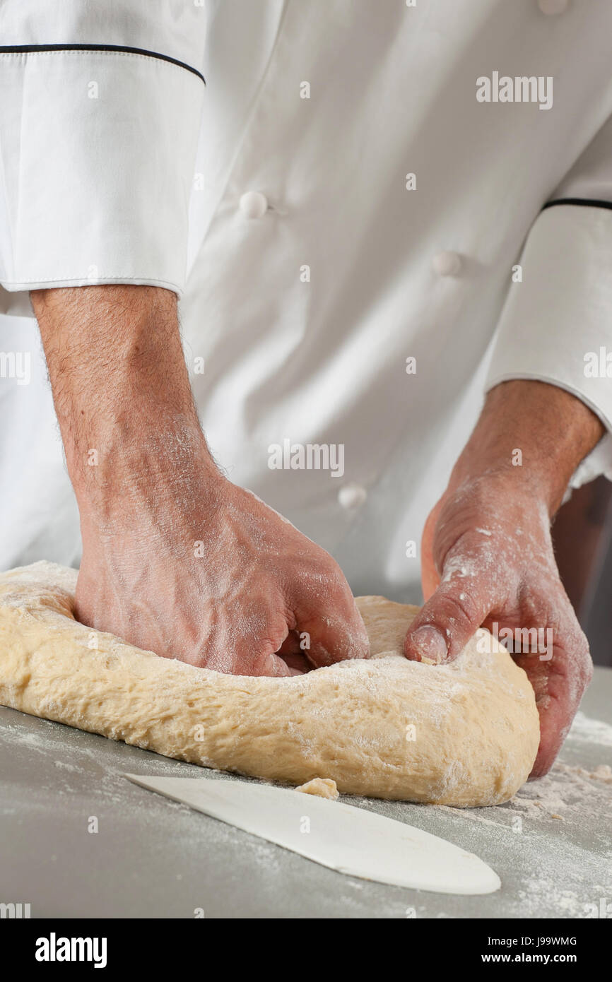 Chef kneading dough, Making dough by male hands at bakery Stock Photo ...