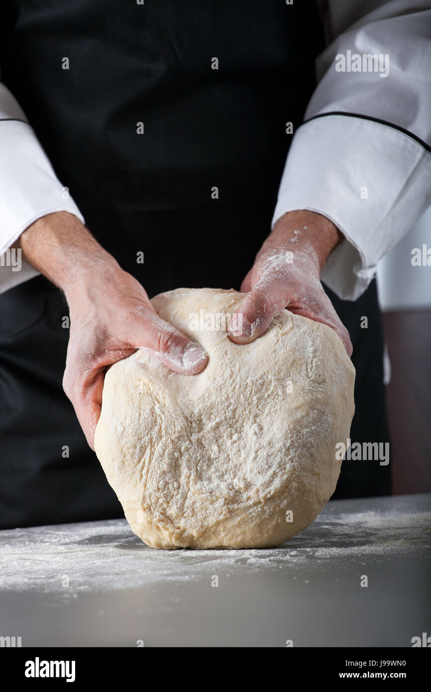 Chef kneading dough, Making dough by male hands at bakery Stock Photo ...