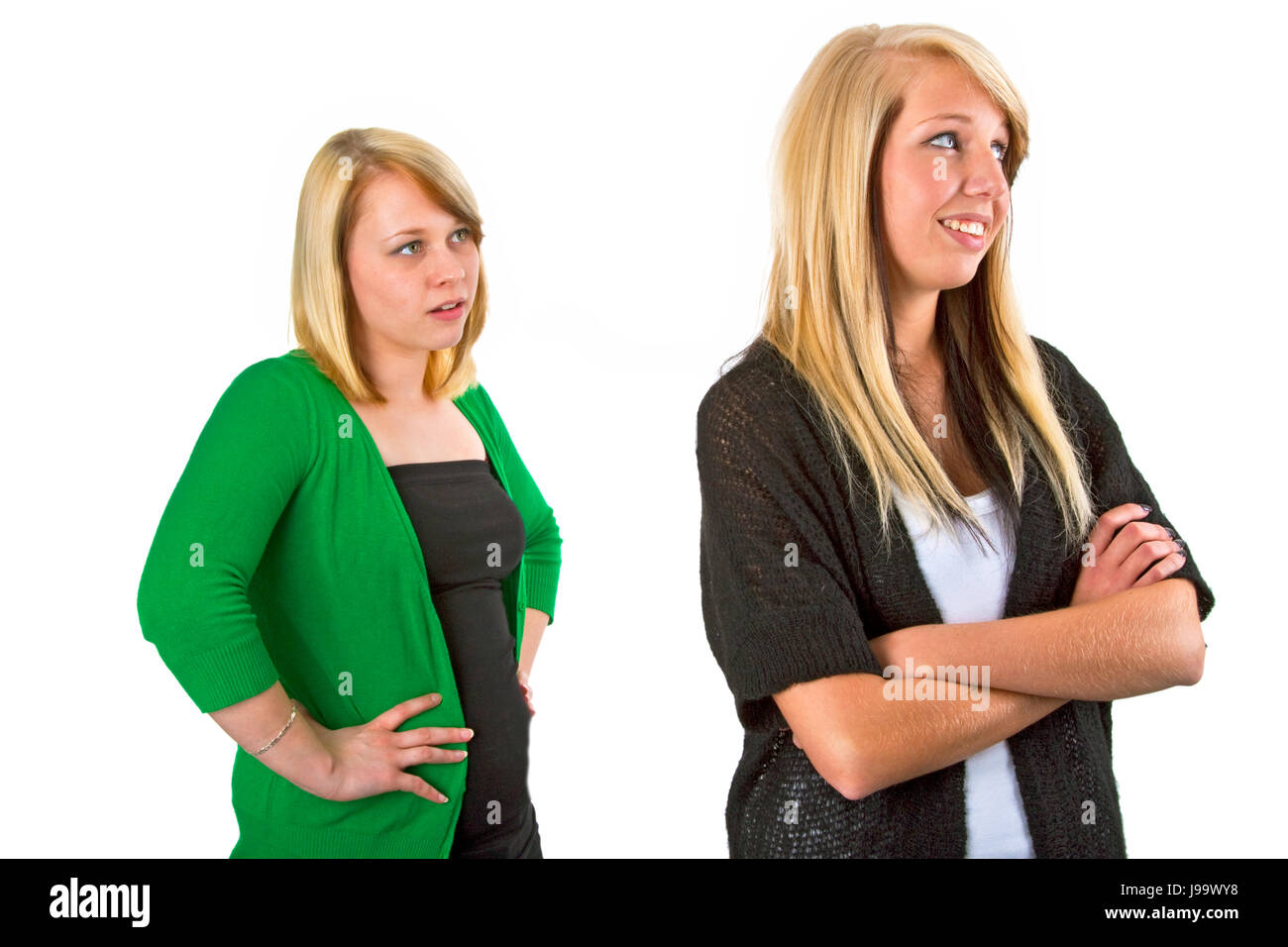 Two woman friends have an argue with each other- isolated on white ...