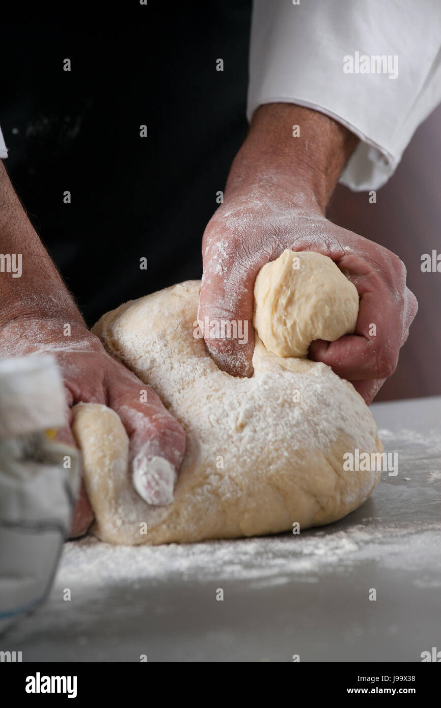 Chef kneading dough, Making dough by male hands at bakery Stock Photo ...