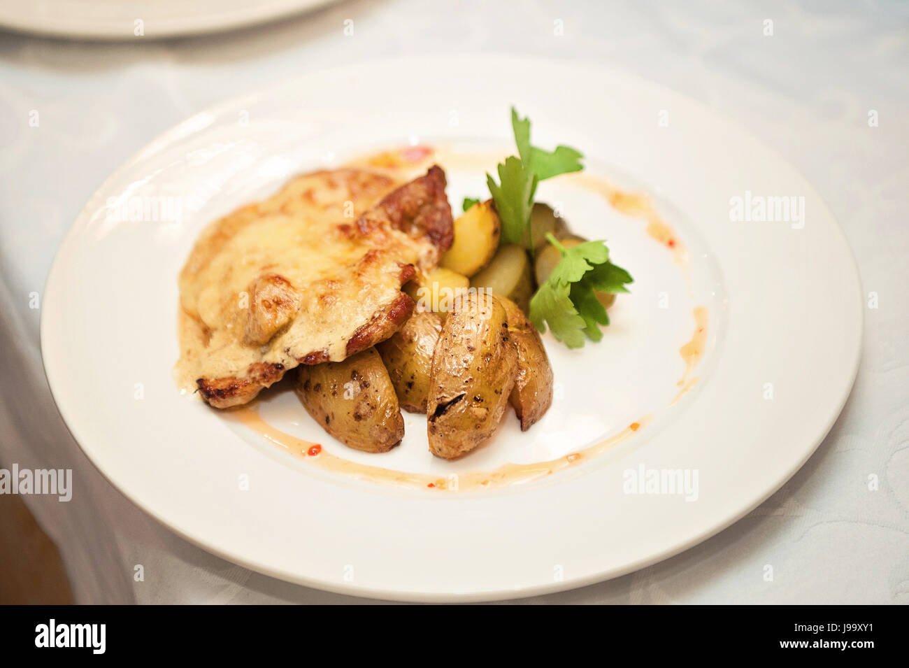 Potatoes baked meat cheese Stock Photo - Alamy