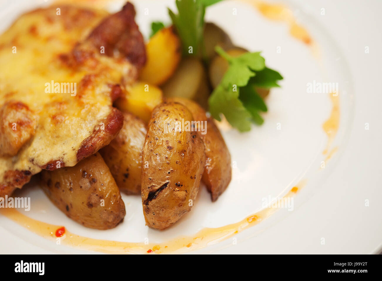 Potatoes baked meat cheese Stock Photo - Alamy