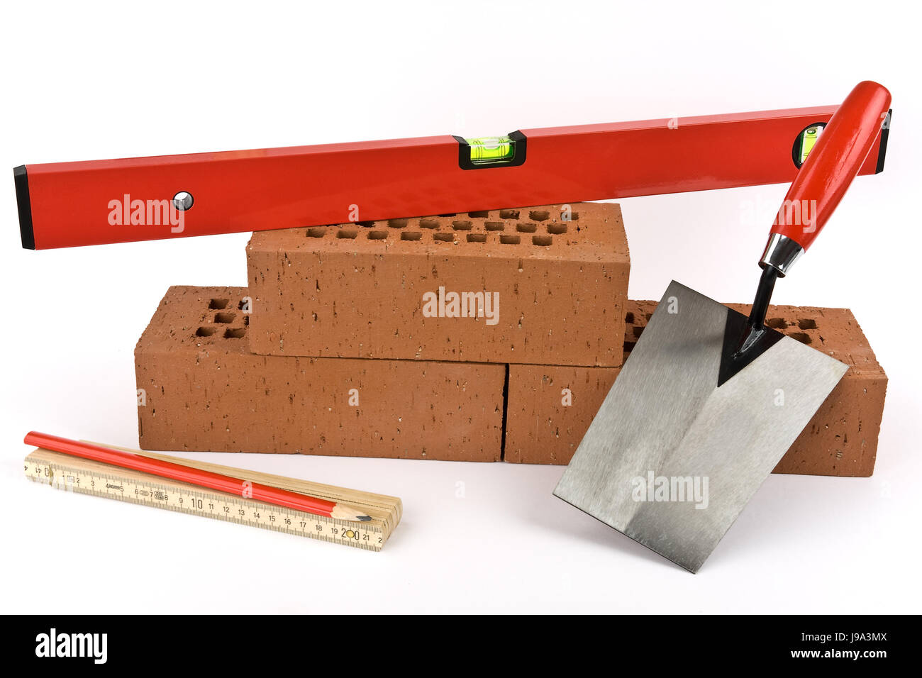 Building bricks hand Cut Out Stock Images & Pictures - Alamy
