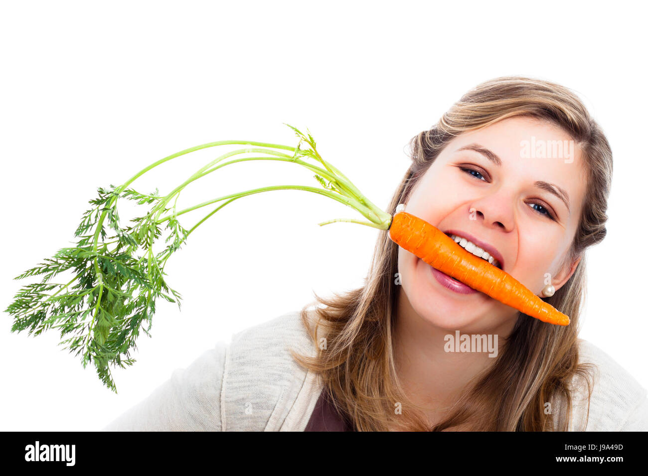 Attractive woman eating carrot hi-res stock photography and images - Alamy