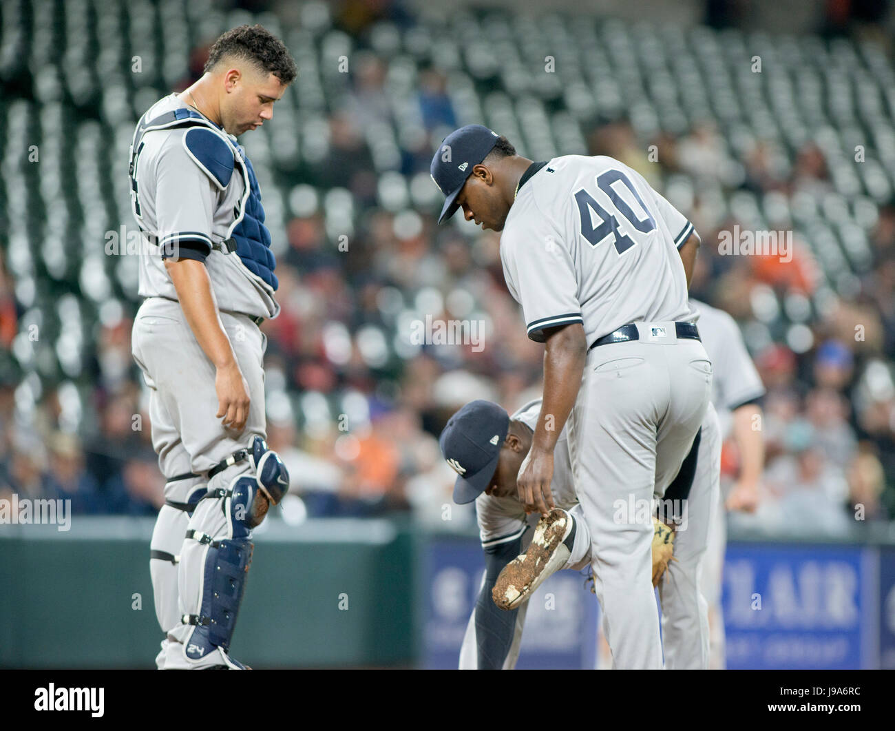 New York Yankees starting pitcher Luis Severino (40) looks at mud that ...