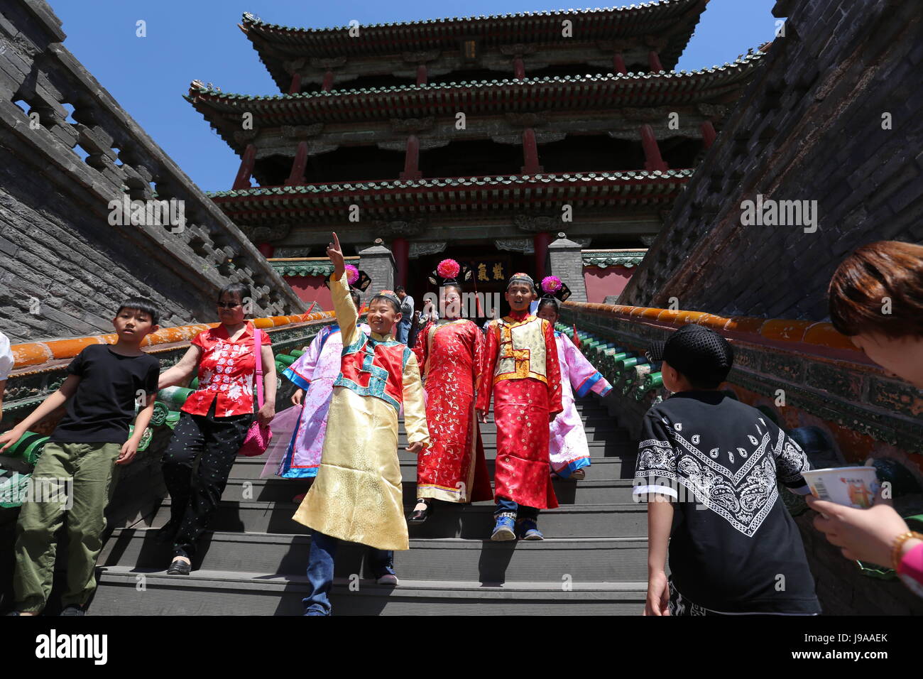 Shenyang, China. 1st June, 2017. Children wearing traditional Manchu ...