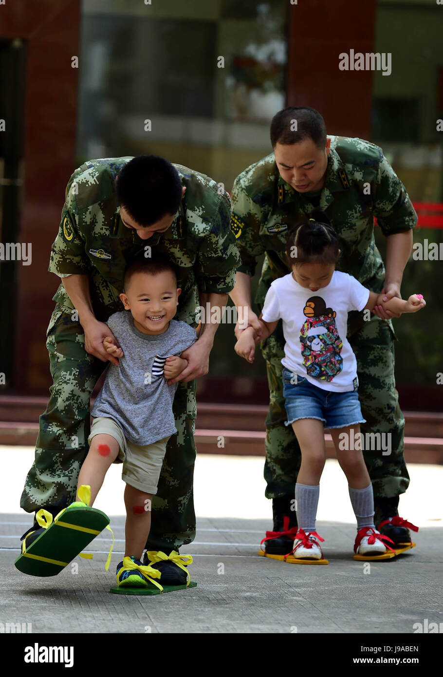 Shenzhen, China. 31st May, 2017. Soldiers' kids have a good time with ...