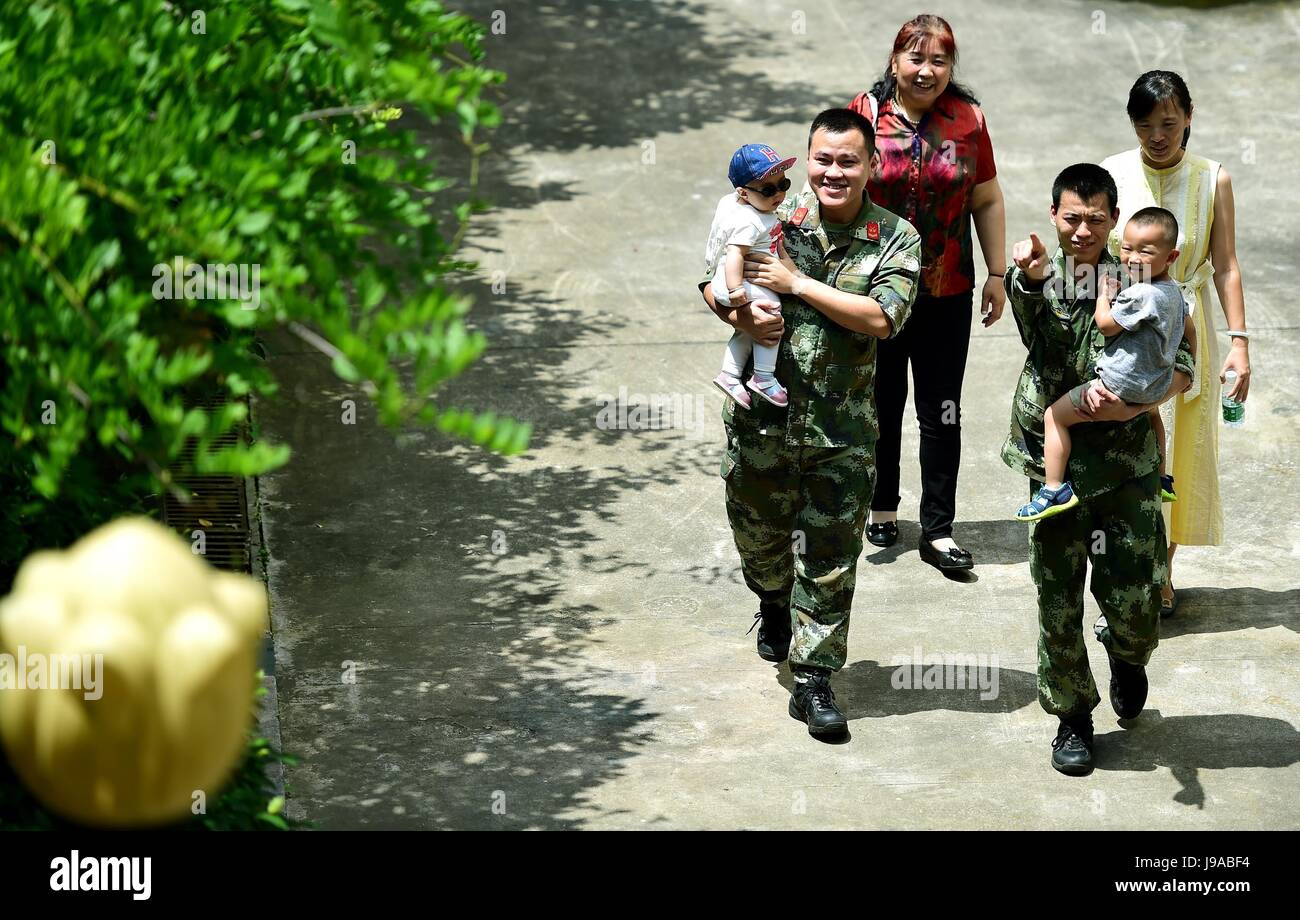 Shenzhen, China. 31st May, 2017. Soldiers' kids have a good time with ...