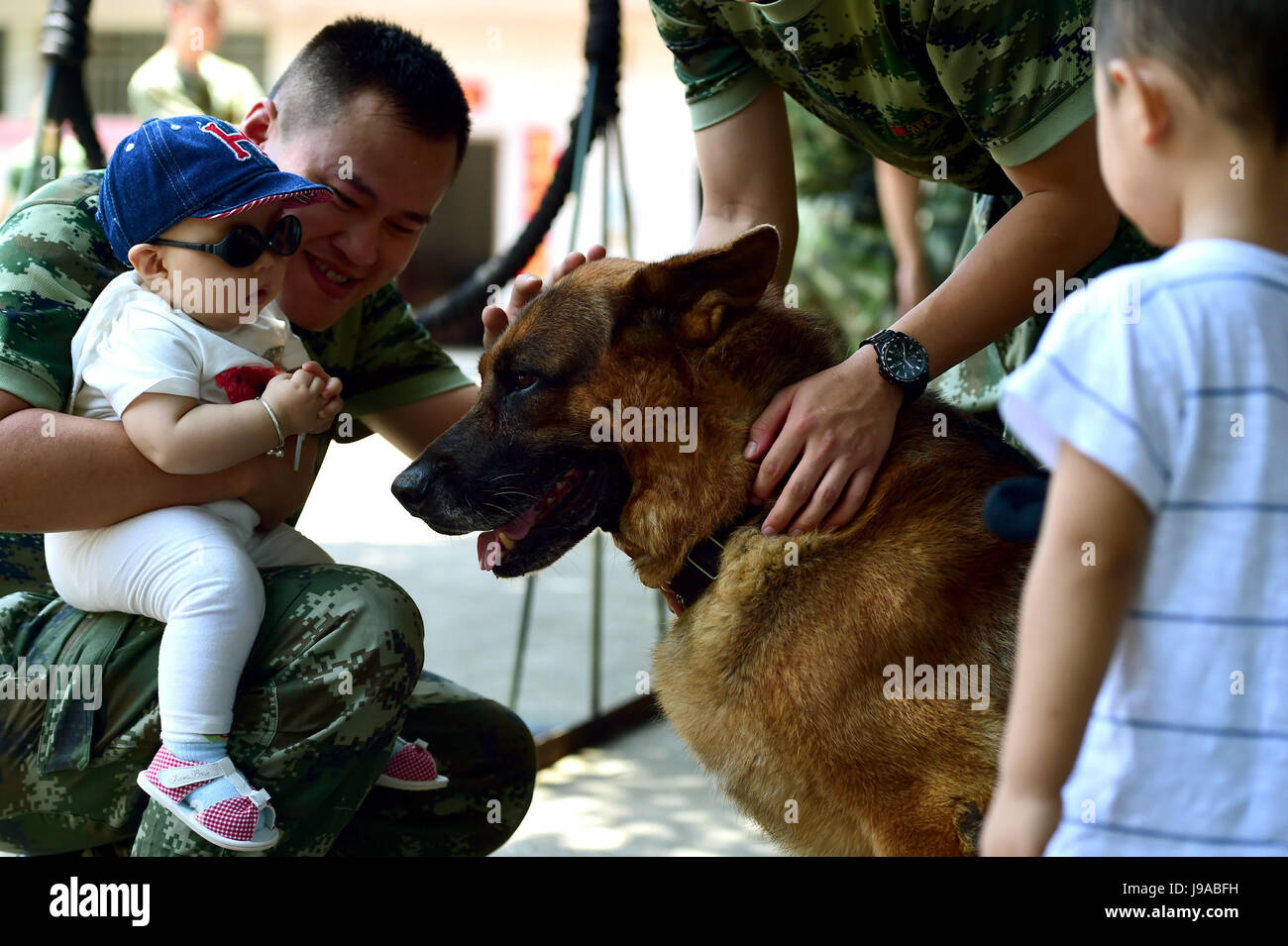 Shenzhen, China. 31st May, 2017. Soldiers' kids have a good time with ...
