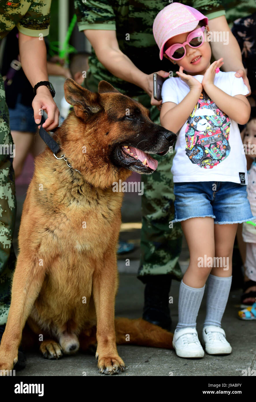 Shenzhen, China. 31st May, 2017. Soldiers' kids have a good time with ...