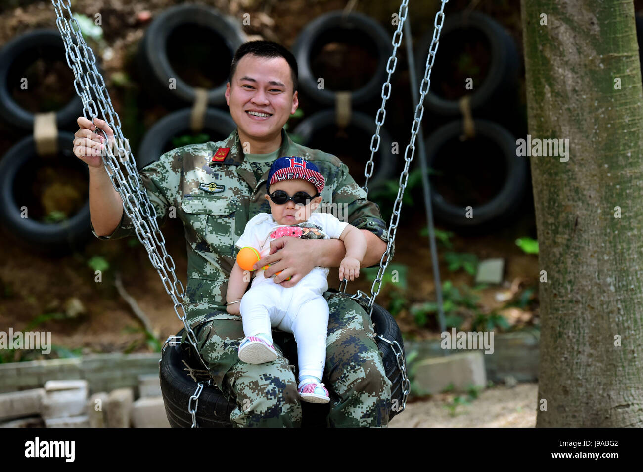 Shenzhen, China. 31st May, 2017. Soldiers' kids have a good time with ...