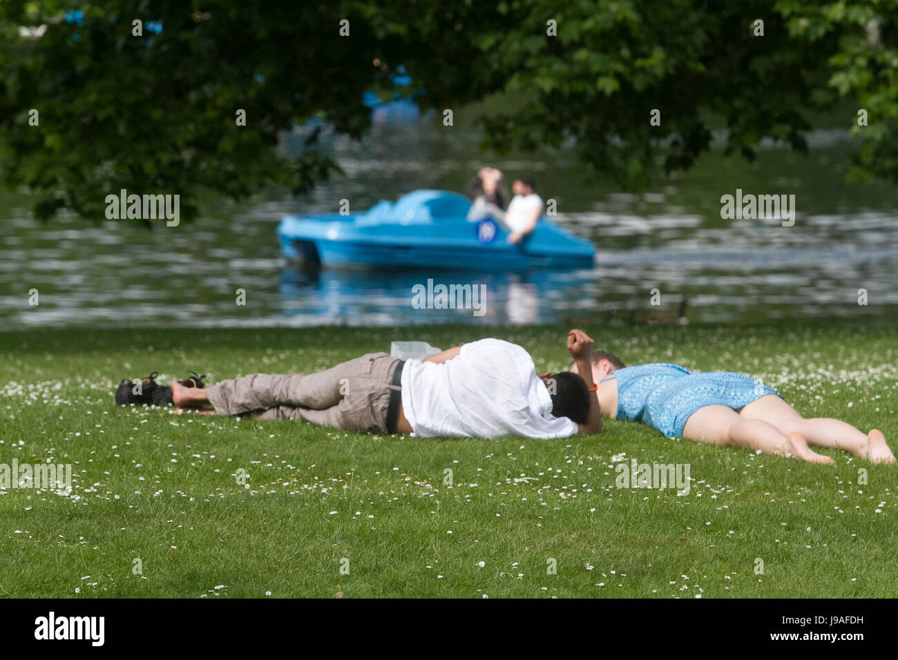 London, UK. 1st June, 2017. People snoozing in Hyde Park on a warm ...