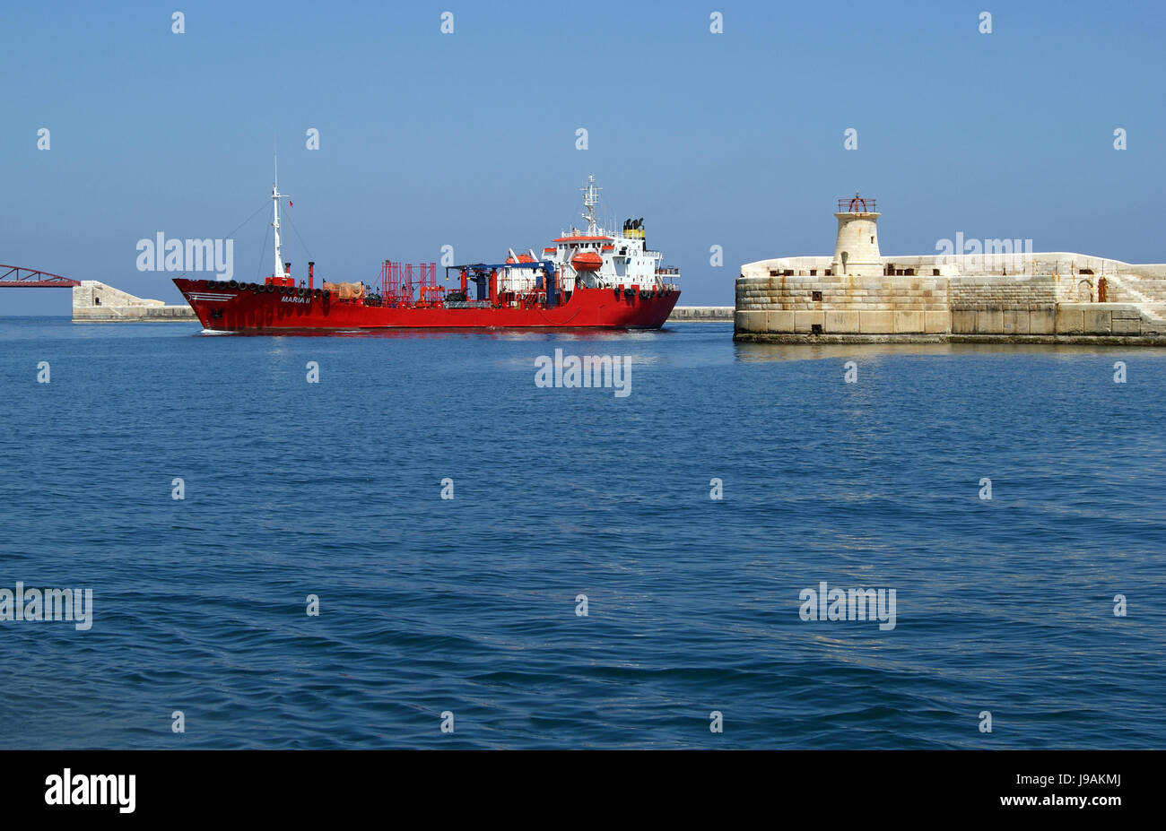 cargo ship at the entrance to the grand harbour - valletta,malta Stock ...