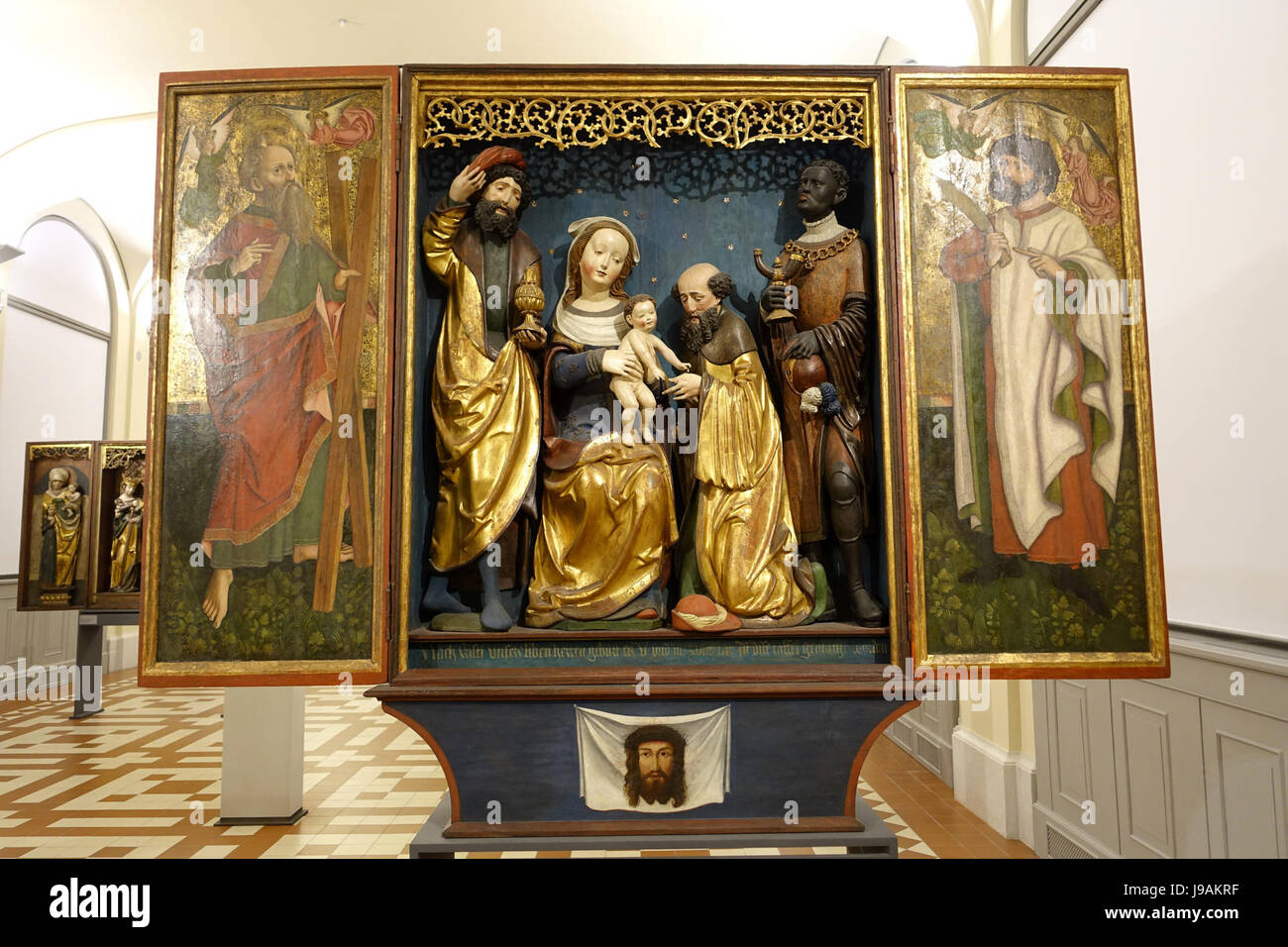 This 1519 winged altarpiece features the Adoration of the Magi scene, created in Upper Bavaria ...
