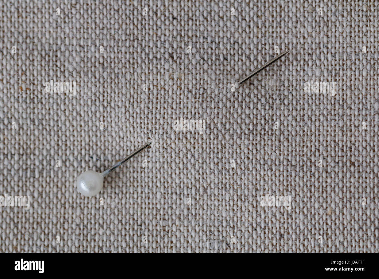 Close-up of sewing pin a linen cloth Stock Photo - Alamy