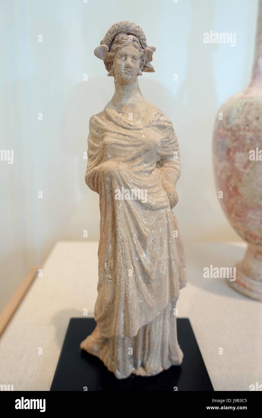 Statuette (Tanagra figurine), Greek, 3rd century BC, molded terracotta ...
