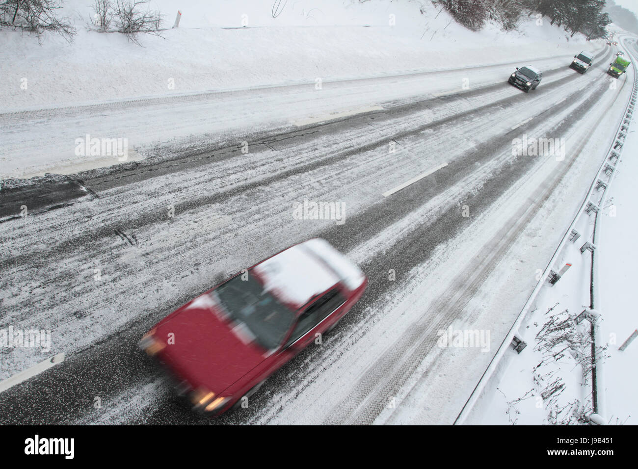 Winter traffic on the motorway in denmark Stock Photo - Alamy