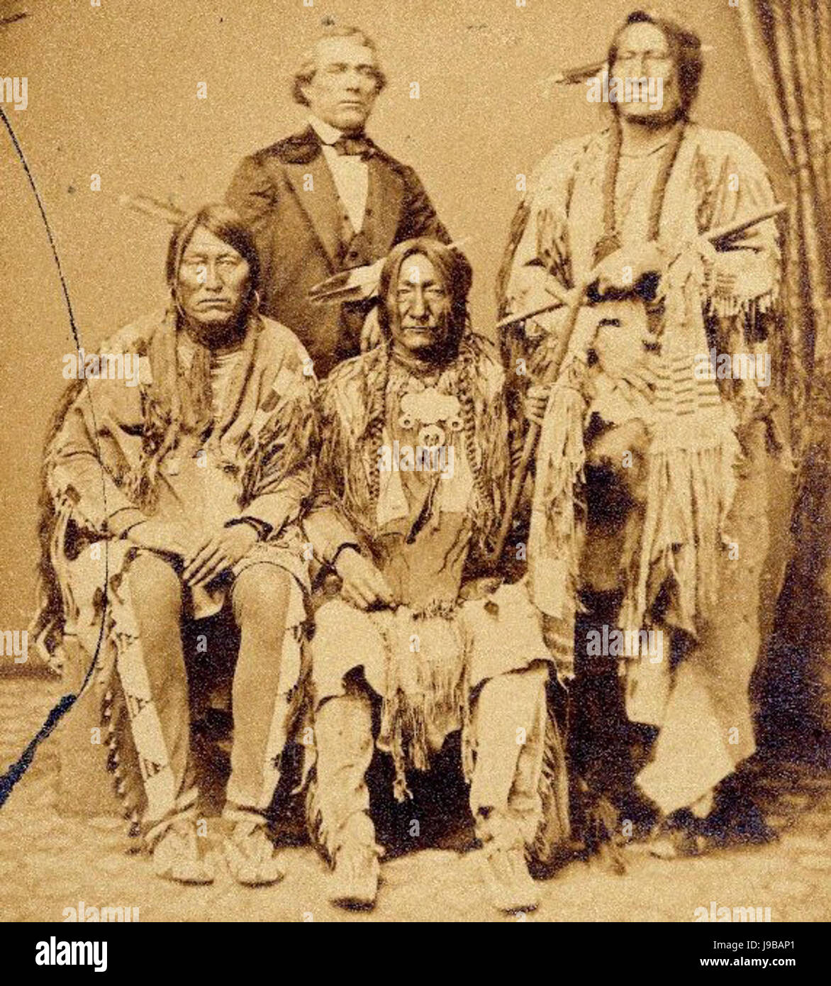 Studio photograph of three Cheyenne chiefs and an interpreter (cropped ...