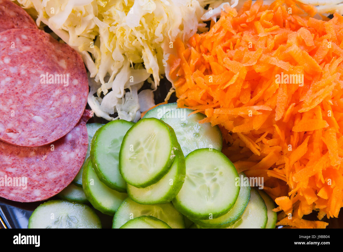 the cut vegetables on a dish are beautifully decorated Stock Photo - Alamy