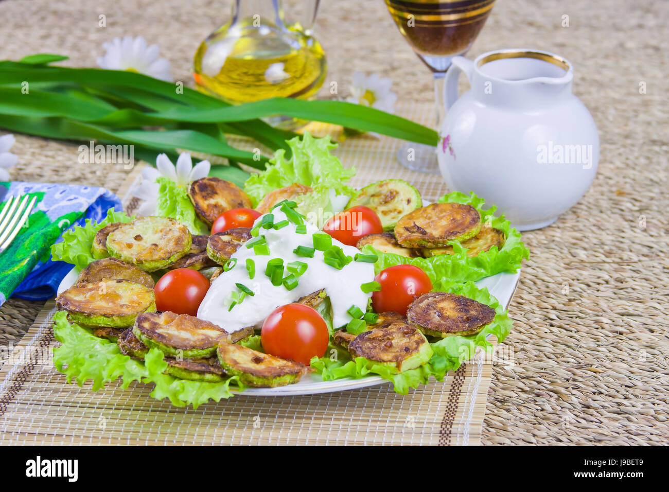 baked vegetable marrows with tomatoes and green sheet lettuce Stock ...