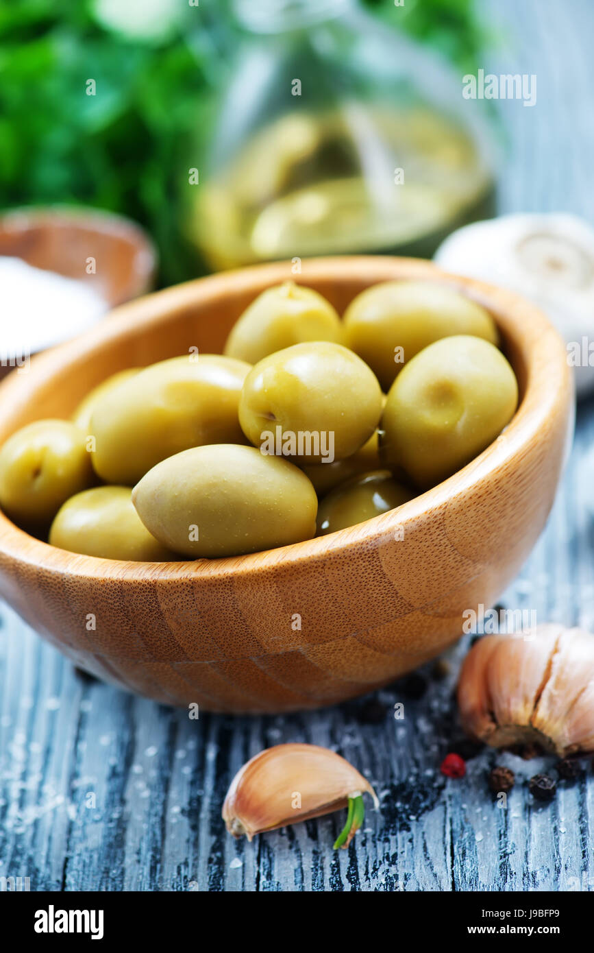 green olives with spice in the bowl Stock Photo - Alamy