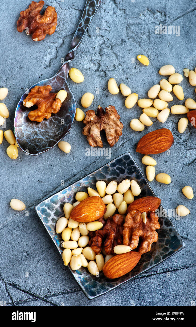 mix of nuts on the plate, stock photo Stock Photo - Alamy